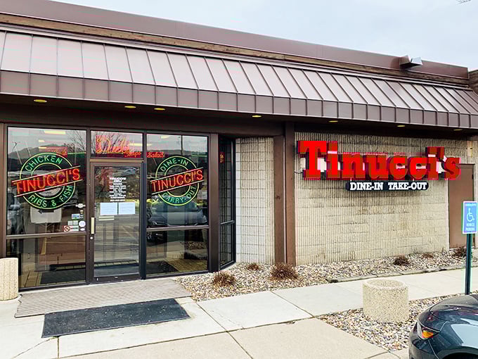 The welcoming storefront of Tinucci's beckons hungry visitors with its iconic red signage and promise of homestyle abundance.