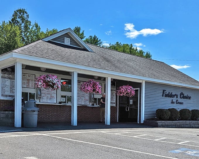 Fielder's Choice exterior welcomes ice cream enthusiasts with its charming New England architecture and vibrant hanging flower baskets.