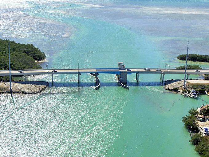 The iconic Overseas Highway stretches across impossibly turquoise waters, connecting Islamorada's islands like a concrete necklace strung through paradise.