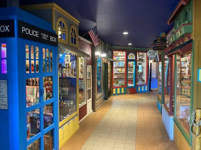 The iconic Lark Toys storefront welcomes visitors with its cheerful blue and white sign – a beacon of joy along Minnesota's Highway 61.