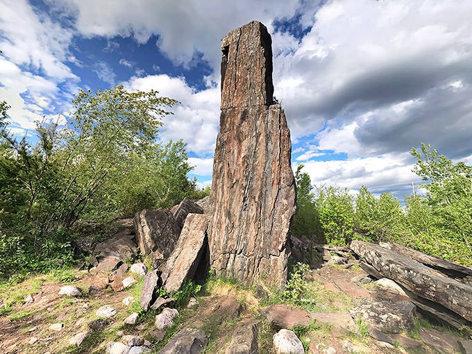 Magnetic Rock stands like a sentinel from another world, towering 60 feet above the forest floor with prehistoric majesty.