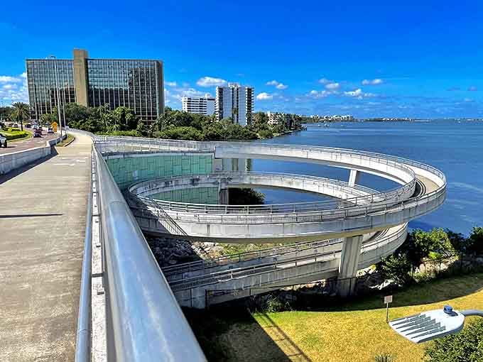 The Memorial Causeway's futuristic spiral overpass looks like a concrete roller coaster for bikes – thrills without the screaming!