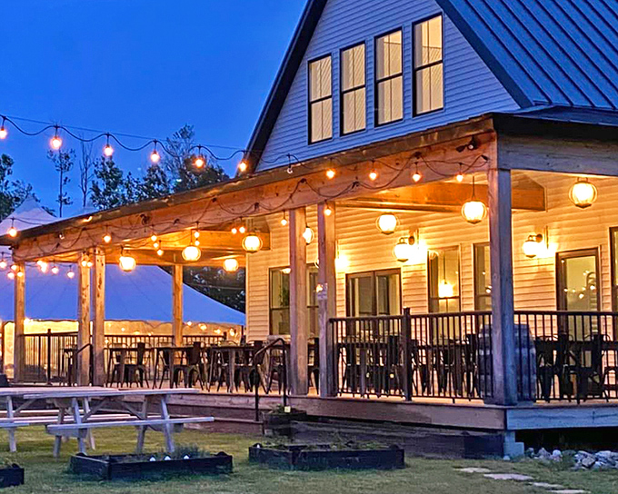 Twilight transforms No. 10 Eatery into a magical dining destination, with string lights casting a warm glow across the farmhouse porch.