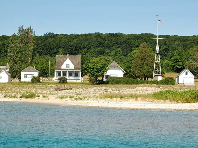 White cottages stand sentinel along Lake Michigan's shore, a historic outpost where wilderness begins and civilization fades away.