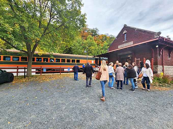 The historic Osceola Depot welcomes visitors with vintage charm as passengers gather for their scenic railway adventure through Wisconsin's hidden valleys.