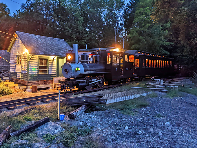 The Sandy River & Rangeley Lakes Railroad station glows with vintage charm at dusk, the locomotive ready for tomorrow's adventure through Maine's countryside.