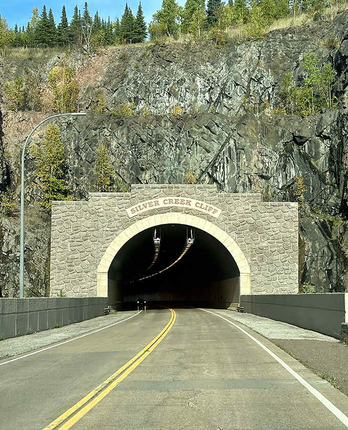 The iconic stone archway of Silver Creek Cliff Tunnel welcomes travelers, standing like a gateway between worlds carved into Minnesota's ancient bedrock.