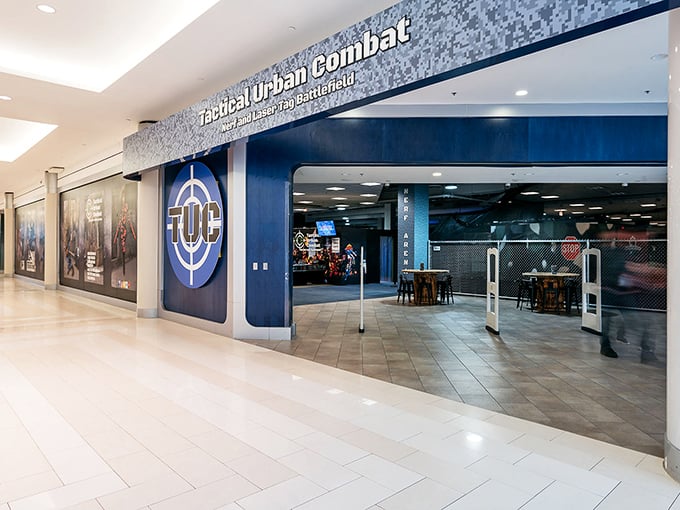The sleek entrance to Tactical Urban Combat beckons mall-goers with promises of foam-flinging adventures beyond the ordinary shopping experience.