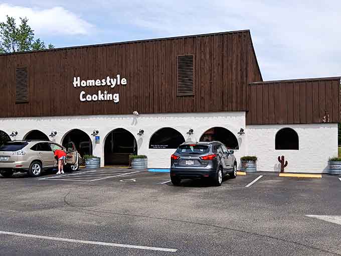 That distinctive facade with its arched openings and "Homestyle Cooking" sign is like a beacon calling hungry travelers to comfort food paradise.