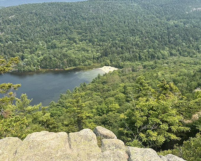 A breathtaking aerial view of Echo Lake nestled among Maine's verdant forests, nature's own infinity pool.