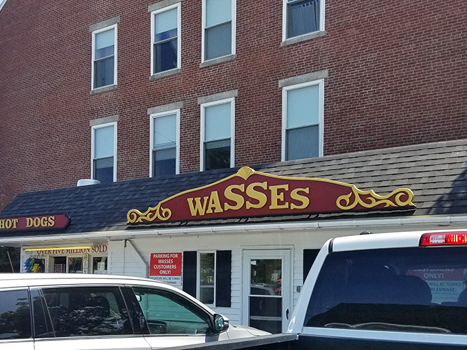 The iconic Wasses storefront stands proudly in Rockland, a burgundy and gold beacon for hot dog aficionados seeking Maine's ultimate comfort food experience.
