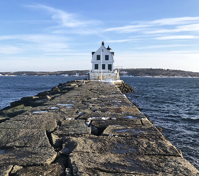Standing sentinel at the end of a nearly mile-long granite path, Rockland Breakwater Lighthouse welcomes intrepid walkers with historic charm.