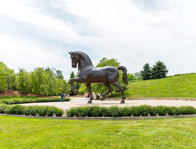The American Horse stands tall against Michigan skies, a 24-foot bronze giant that makes visitors feel delightfully ant-sized by comparison.