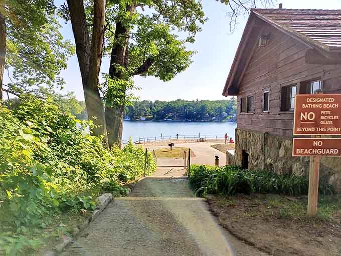 A sandy path leads to paradise – Wilson State Park's beach entrance promises lake views and memory-making opportunities ahead.