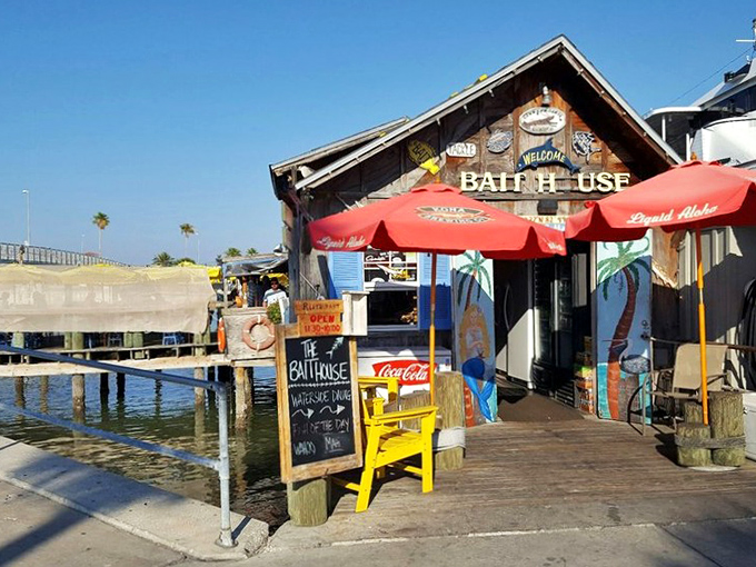The Bait House stands proudly on its waterfront perch, red awnings fluttering in the breeze like flags welcoming hungry sailors home.