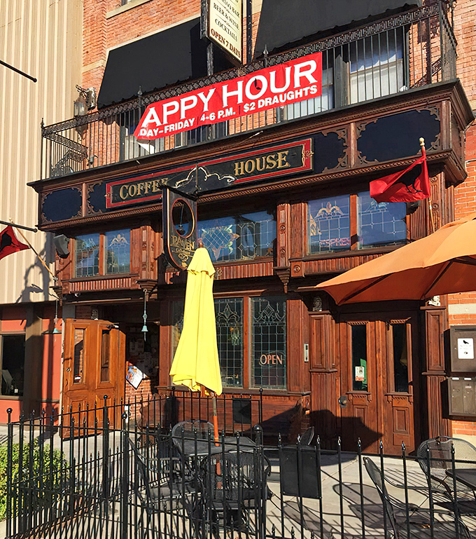 The Raven Café's Victorian façade beckons with literary charm – that happy hour sign doesn't hurt either! Books and brews, what could be better?