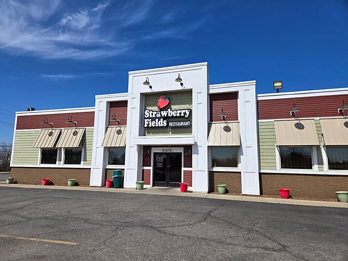 Exterior: The unassuming storefront of Strawberry Fields Restaurant beckons with its bright sign, promising musical nostalgia and comfort food that hits all the right notes.