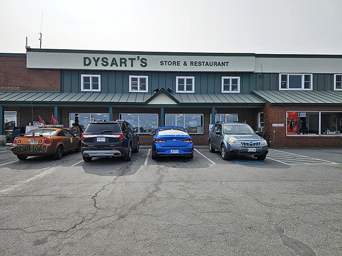 The iconic green-roofed exterior of Dysart's welcomes travelers 24/7, a beacon of comfort for hungry souls on Maine's highways.