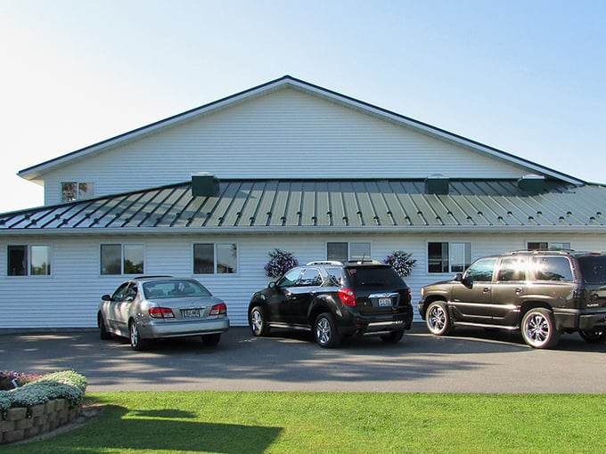 The unassuming exterior of Mishler's Country Store belies the treasure trove within &ndash; simplicity in white siding and a practical metal roof.