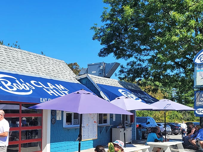 The iconic blue awning of Bob's Clam Hut beckons seafood lovers like a lighthouse guiding hungry sailors home.