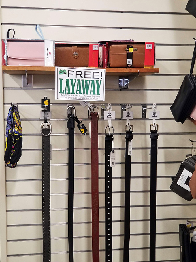 The accessories corner offers practical leather goods with that "free layaway" sign reminding us of Renys' old-school customer service.