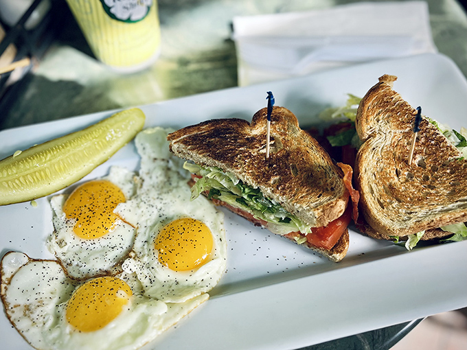 Breakfast with a view &ndash; perfectly cooked eggs alongside a sandwich that proves even classics can be elevated with the right touch.
