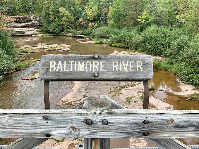 The humble Baltimore River &ndash; this unassuming waterway creates the spectacular falls downstream, proving greatness often comes from modest beginnings.