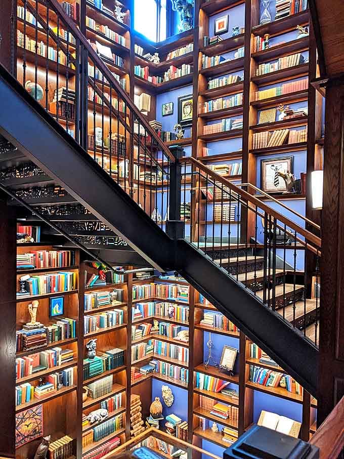This library tower spirals upward like something from a bibliophile's fever dream, with enough books to keep you reading until the next ice age.
