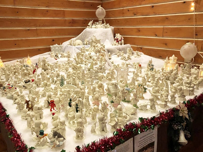 An army of snowfolk stands at attention in this winter display. Like a polar expedition frozen in time, but much more festive.