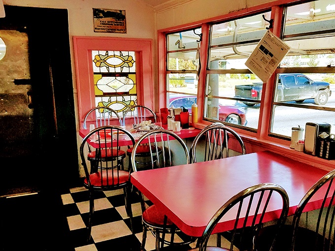 Stained glass windows and cherry-red tables&mdash;because diners understand ambiance isn't about chandeliers, it's about character.