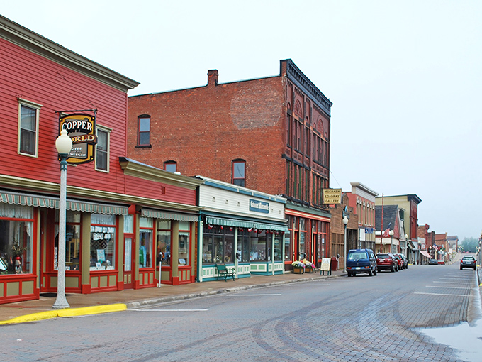Brick buildings stand shoulder to shoulder along Fifth Street, their weathered facades telling silent stories of copper boom prosperity.