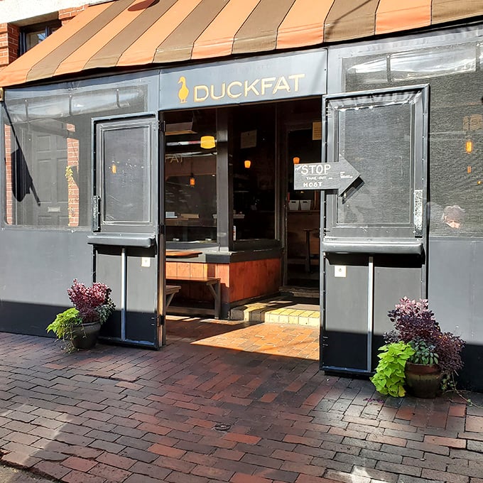 Duckfat's unassuming storefront belies the culinary magic happening inside, where duck fat transforms ordinary fries into crispy, golden objects of desire.