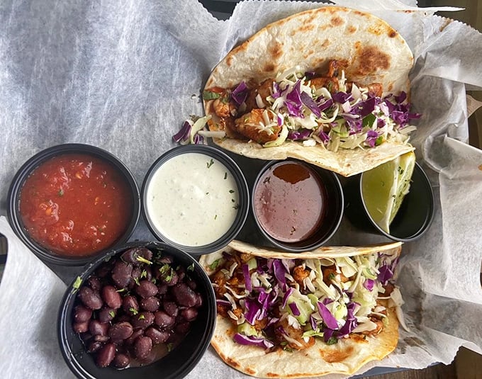 Fish tacos that transport you to coastal Mexico with one bite &ndash; simple, authentic, and served with enough sauces to create your perfect flavor profile.
