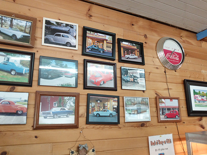 Classic cars adorn wooden walls, showcasing local pride and history while customers wait for their legendary pizza orders.