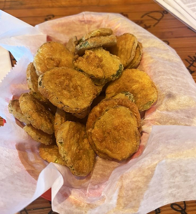 Fried pickle chips that crunch like autumn leaves – tangy, golden-brown discs of joy that'll convert even the pickle-skeptical among us.