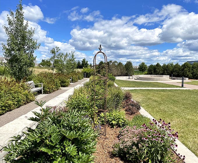 Carefully maintained gardens surround the skating area, their summer beauty hibernating beneath snow until spring decides to make an appearance again.