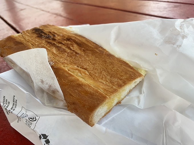 Grilled cheese perfection &ndash; golden-brown exterior giving way to molten cheese that stretches dramatically with each bite, like in the commercials.