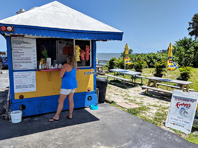 Order Window: The humble command center of flavor &ndash; a compact kitchen where hot dog magic happens while the Indian River Lagoon sparkles just steps away.