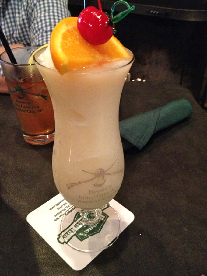 A piña colada that makes you forget you're in Michigan, not Miami – complete with the obligatory cherry and orange slice.
