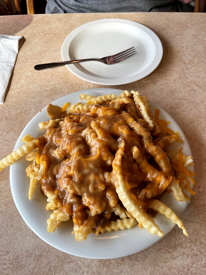 Poutine that could make a Canadian proud &ndash; crispy fries smothered in gravy and cheese that stretches with each heavenly forkful.