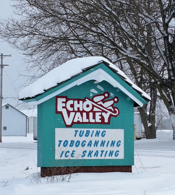 The charming sign welcomes visitors to a triple threat of winter fun &ndash; where tobogganing, tubing, and ice skating create the perfect cold-weather trifecta.