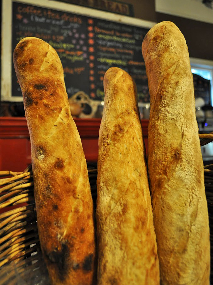 These artisanal baguettes stand tall and proud, with crusts that crackle louder than your knees after a long hike.