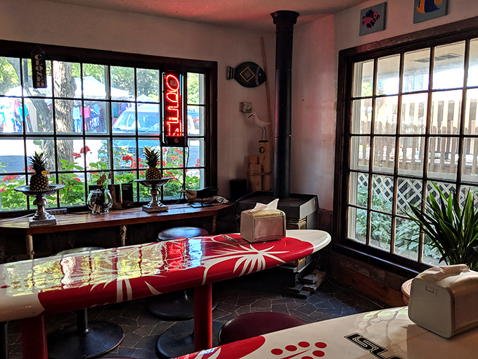 Dining area featuring what appears to be a surfboard table, because when you're this creative with chocolate, furniture follows suit naturally.