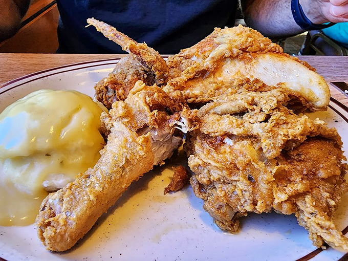 Fried chicken that achieves the golden trifecta: crispy exterior, juicy interior, and seasoning that penetrates all the way to the bone.