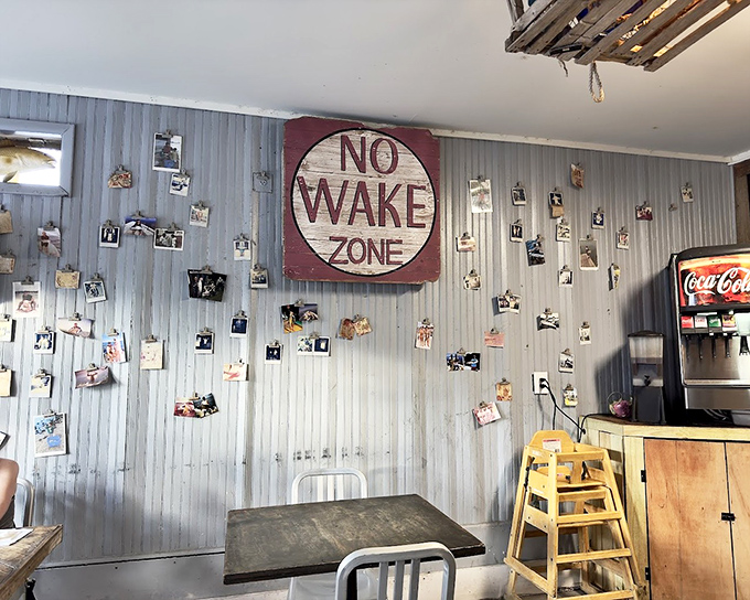 The "No Wake Zone" wall – where photos of happy customers and fishing trophies create the perfect laid-back Florida atmosphere.
