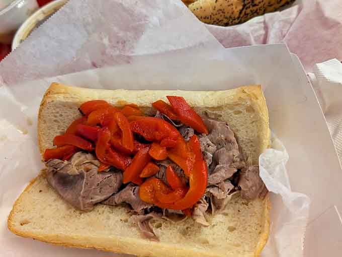 This sandwich means business, piled high with meat and peppers like someone decided "enough" wasn't in their vocabulary, and we're all better for it.