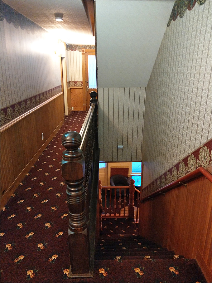 The grand staircase connects three floors of history, hospitality, and the occasional unexplained cold spot that defies HVAC logic.