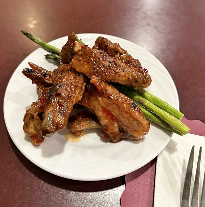 Tender ribs glazed with a sauce that strikes the perfect balance between sweet, tangy, and "can I lick my fingers in public?"
