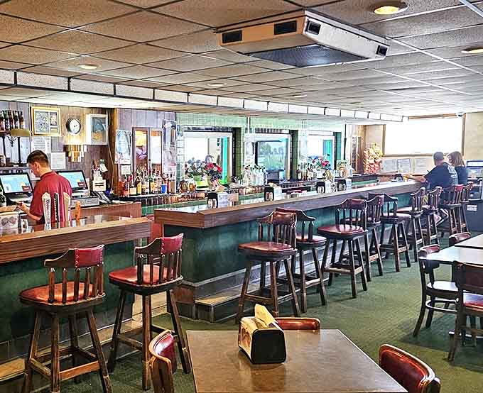 The bar area buzzes with friendly conversation where regulars and newcomers alike feel right at home.