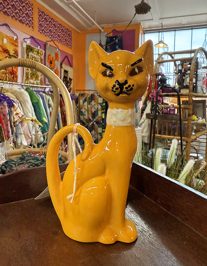 This sassy ceramic feline isn't just kitchenware &ndash; it's mid-century whimsy in pitcher form! Perfect for serving cream with a side of attitude.
